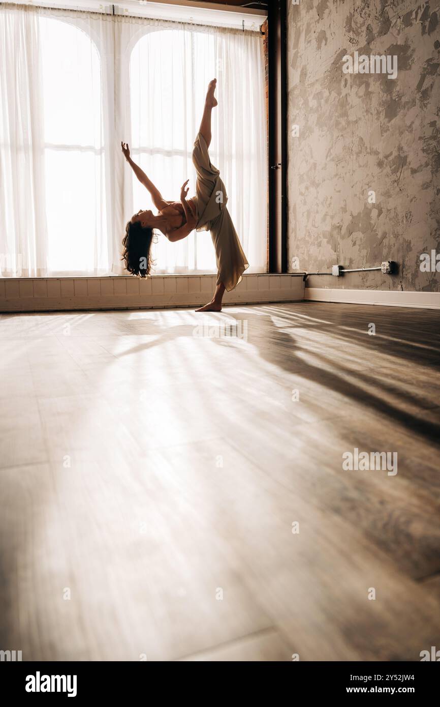 Silhouette contemporary dancer balancing hi-res stock photography and ...