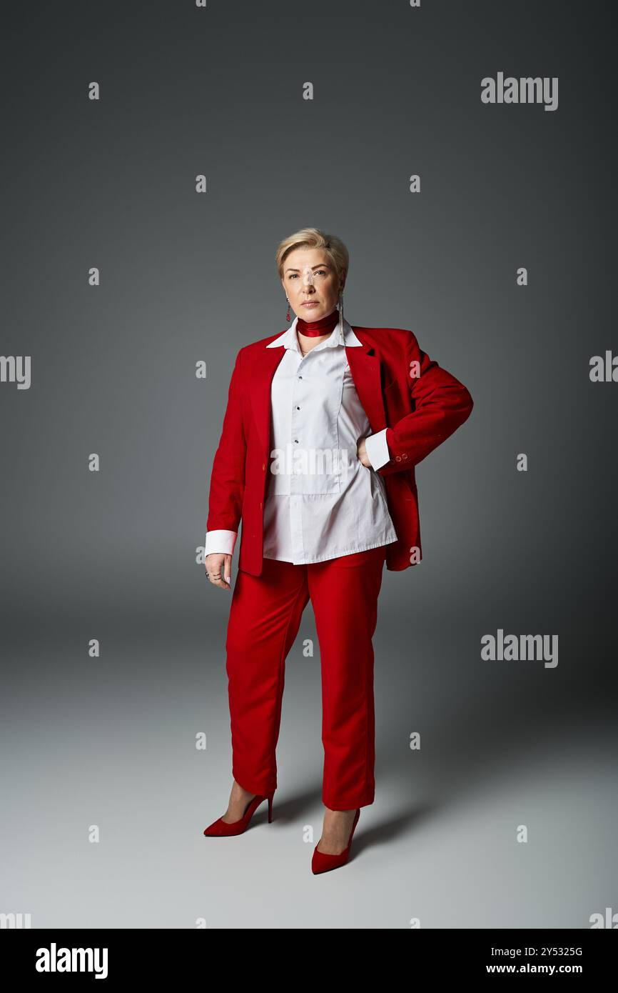 An adult woman exudes confidence in her tailored red suit, striking a ...