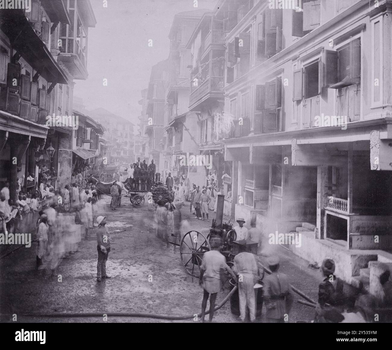 Groups of men on a street spraying jets of water into plague infected ...