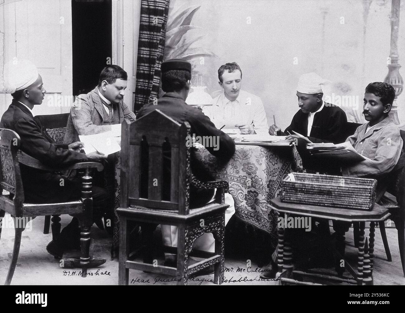 During a plague epidemic in Mandalay, a group of men taking notes at a ...