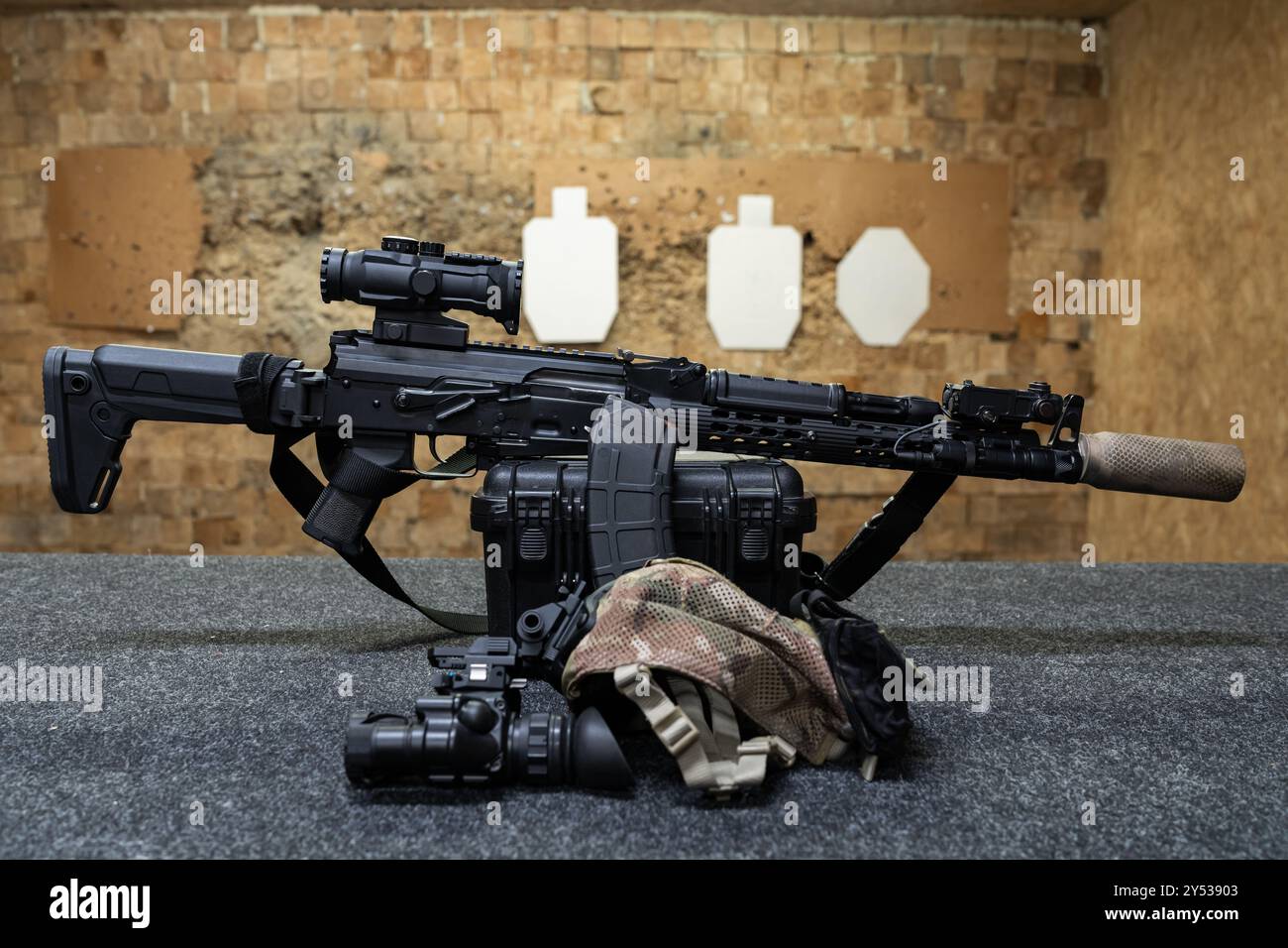 Tactical shooting at a shooting range, AK series rifle with a silencer ...