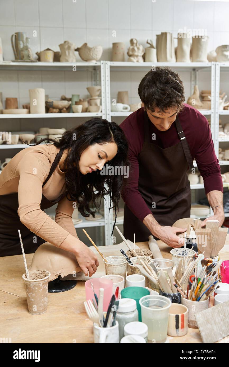 A couple joyfully crafts pottery in a modern studio Stock Photo - Alamy