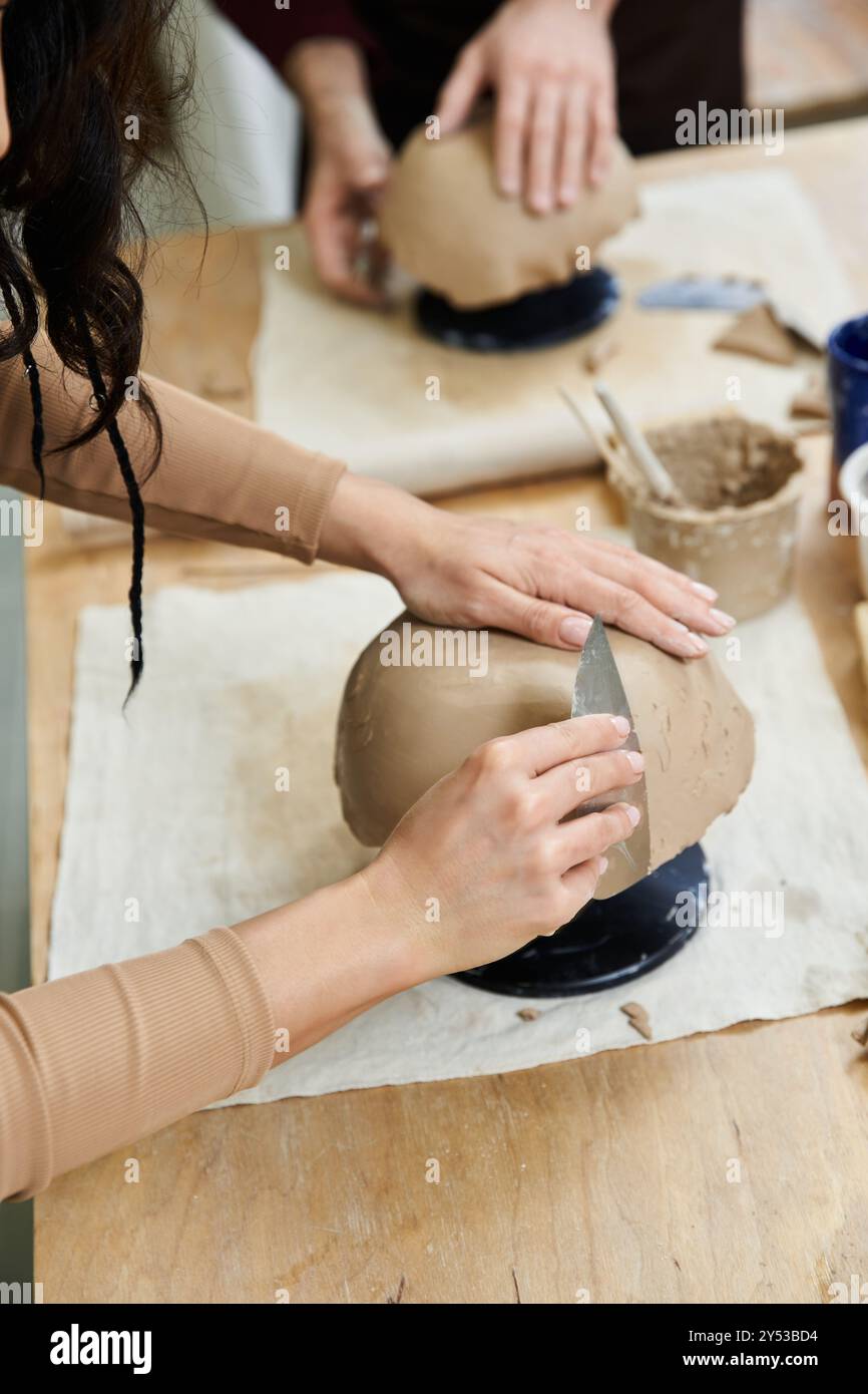 A couple joyfully crafts pottery together in a contemporary workspace ...