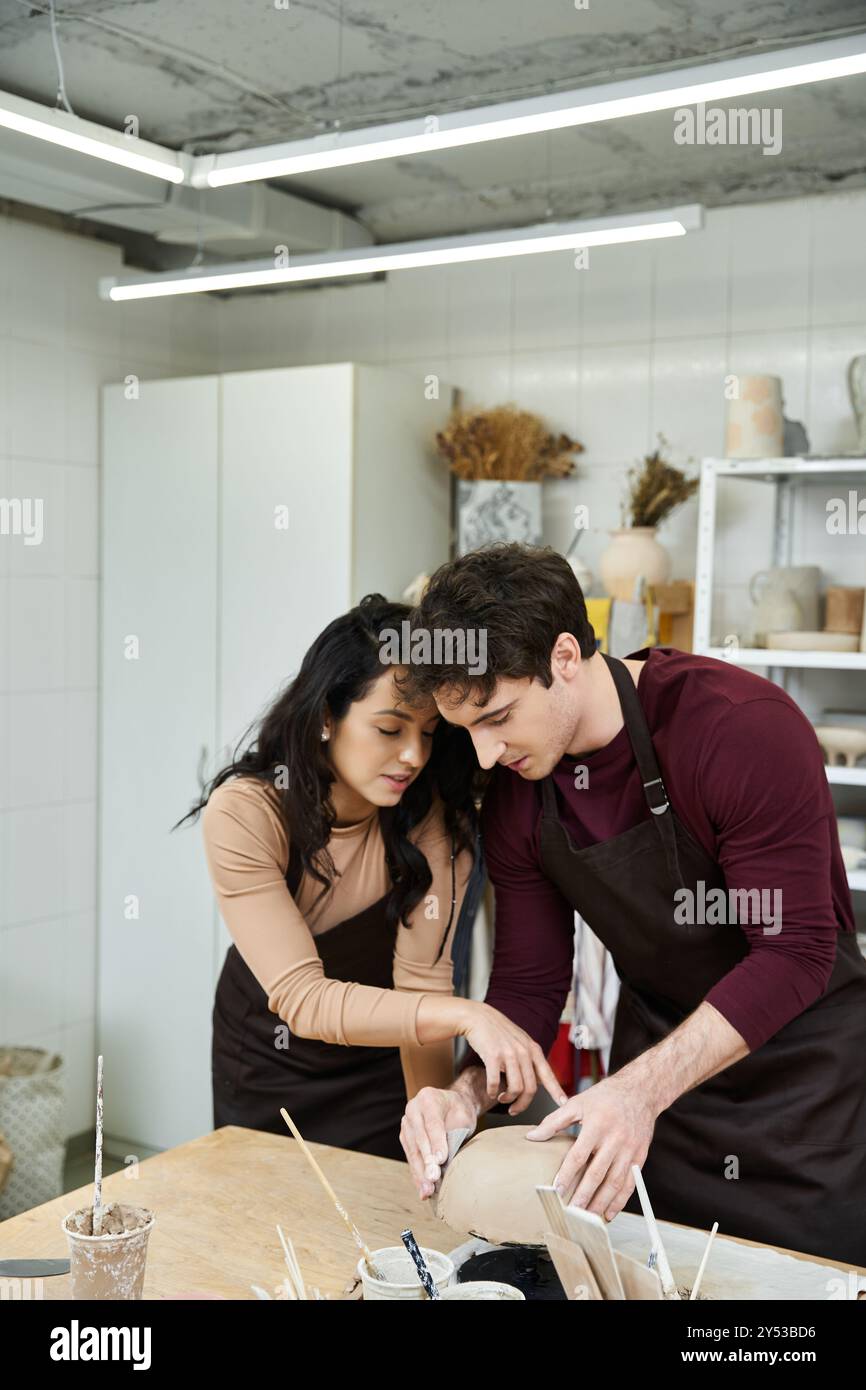 A couple joyfully crafts pottery together in a stylish studio Stock ...