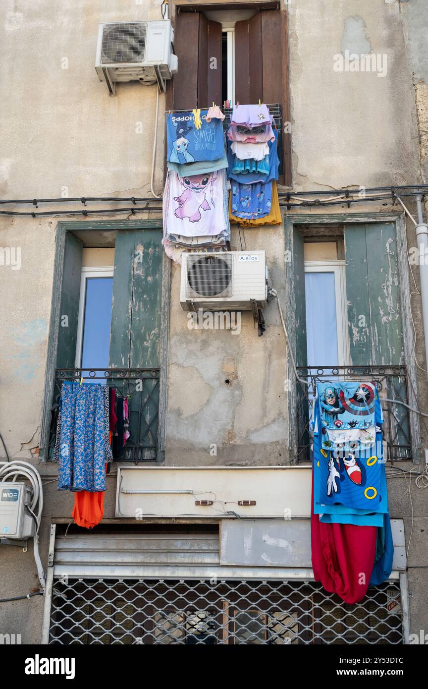 Perpignan, France. Washing drying on balcony in poor housing Stock ...