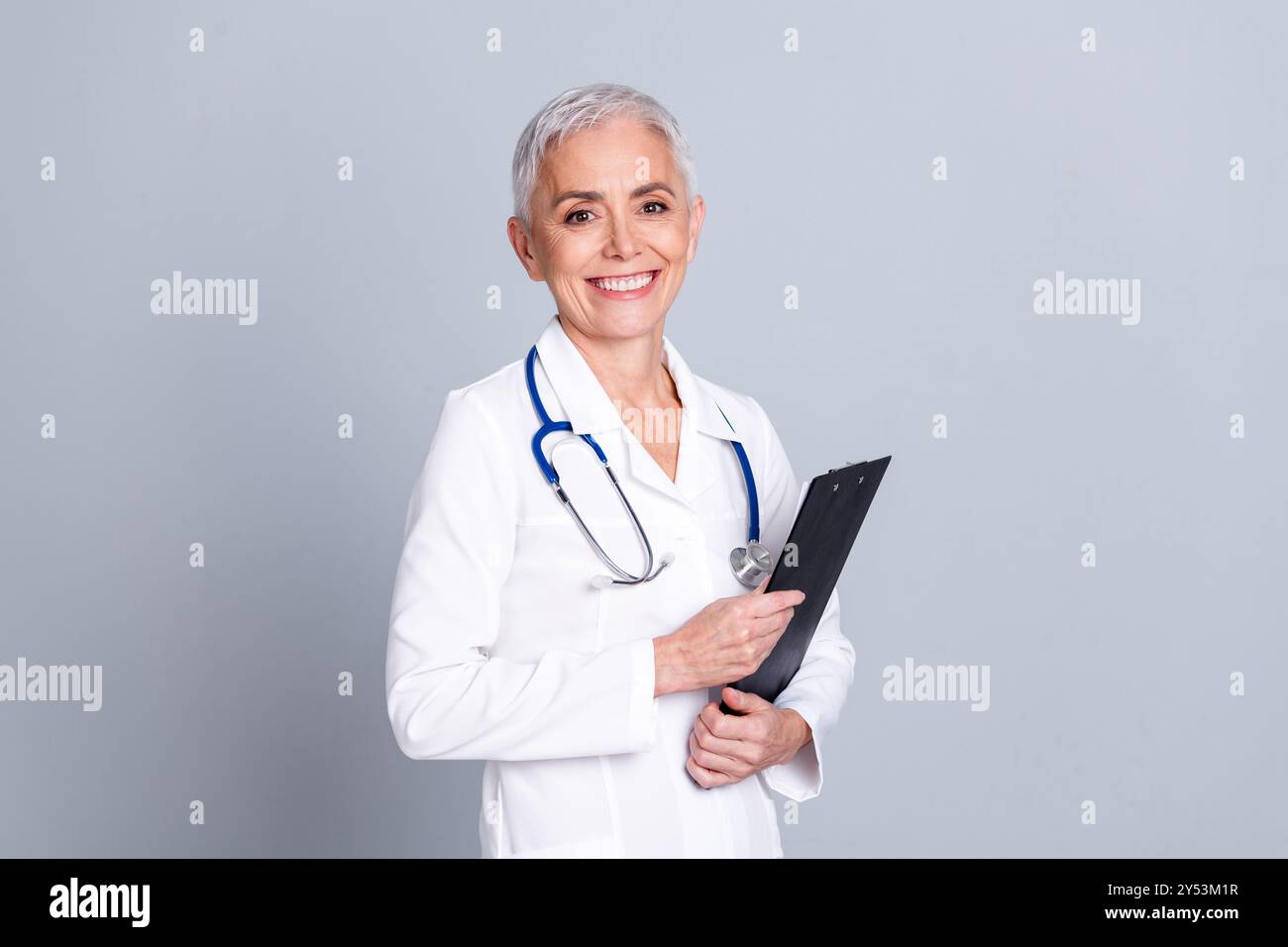 Photo portrait of pretty retired female professional doctor hold ...