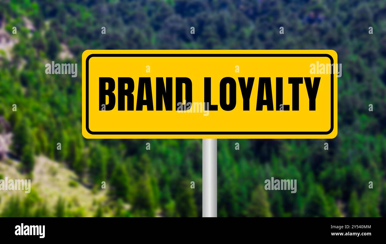 Brand loyalty message written on yellow metal sign on nature background ...