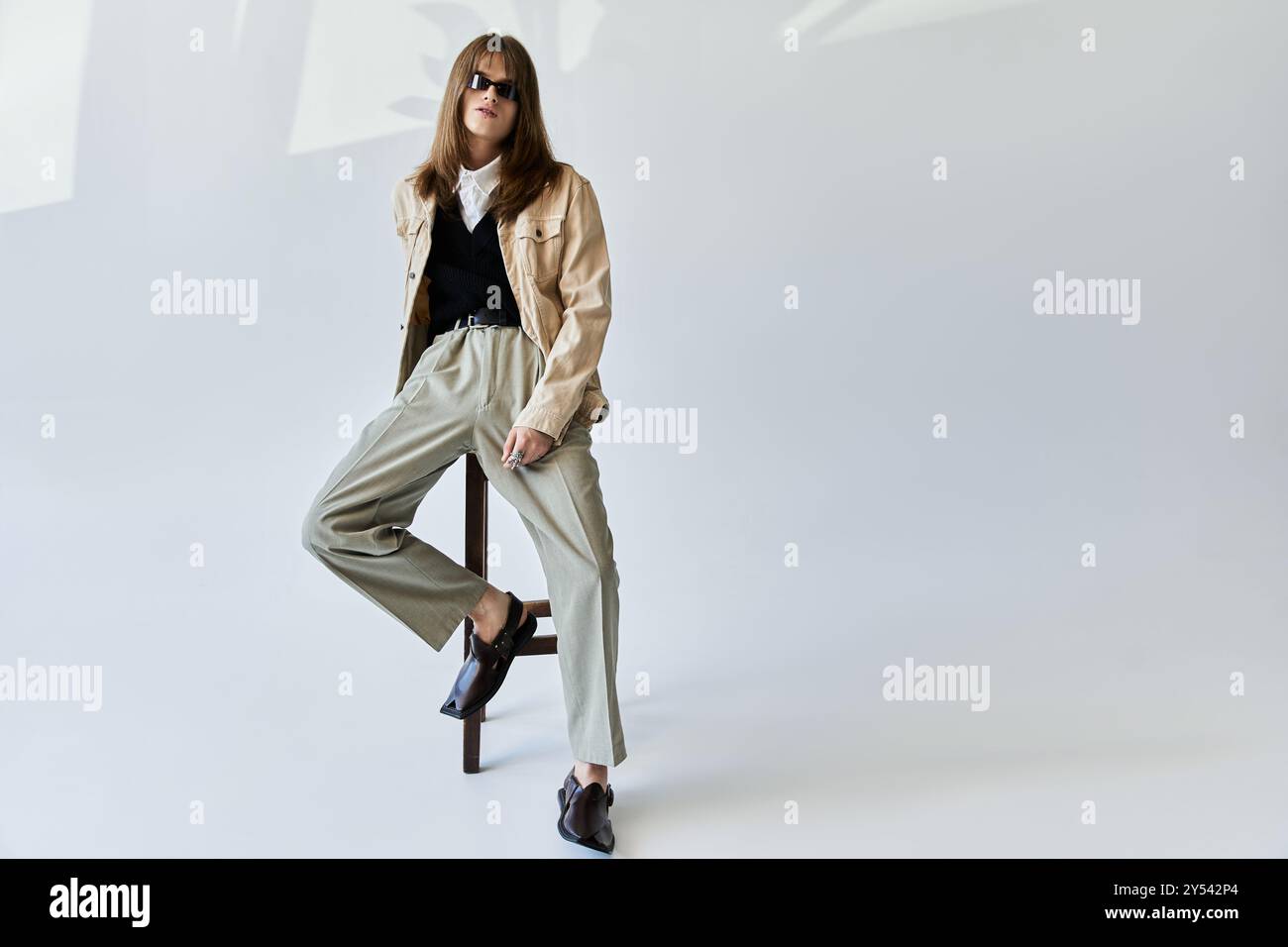 A young man presents his unique fashion sense in an artistic ...