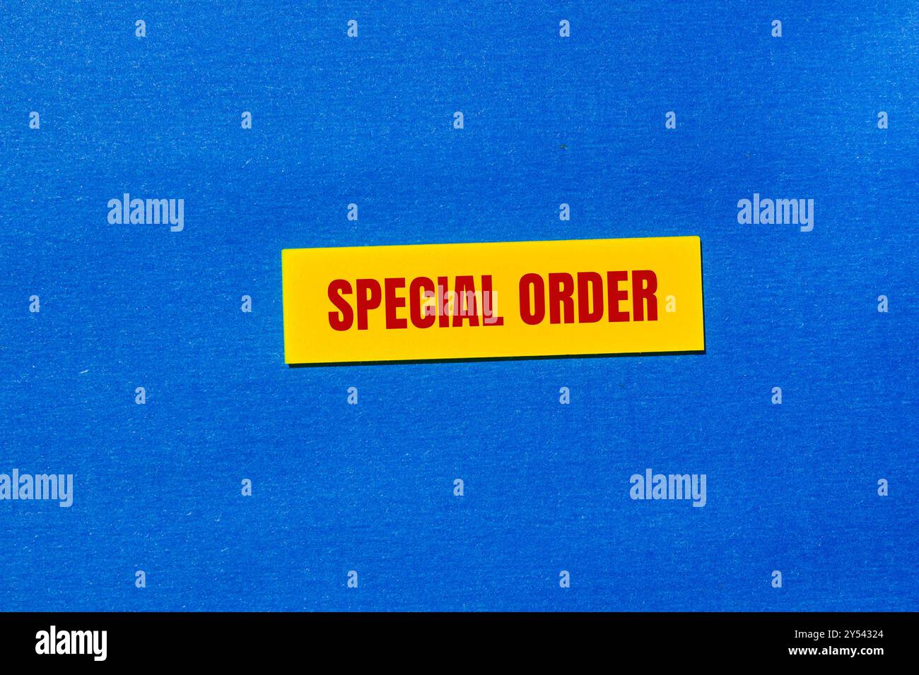 Special order message written on yellow sticker with blue background ...