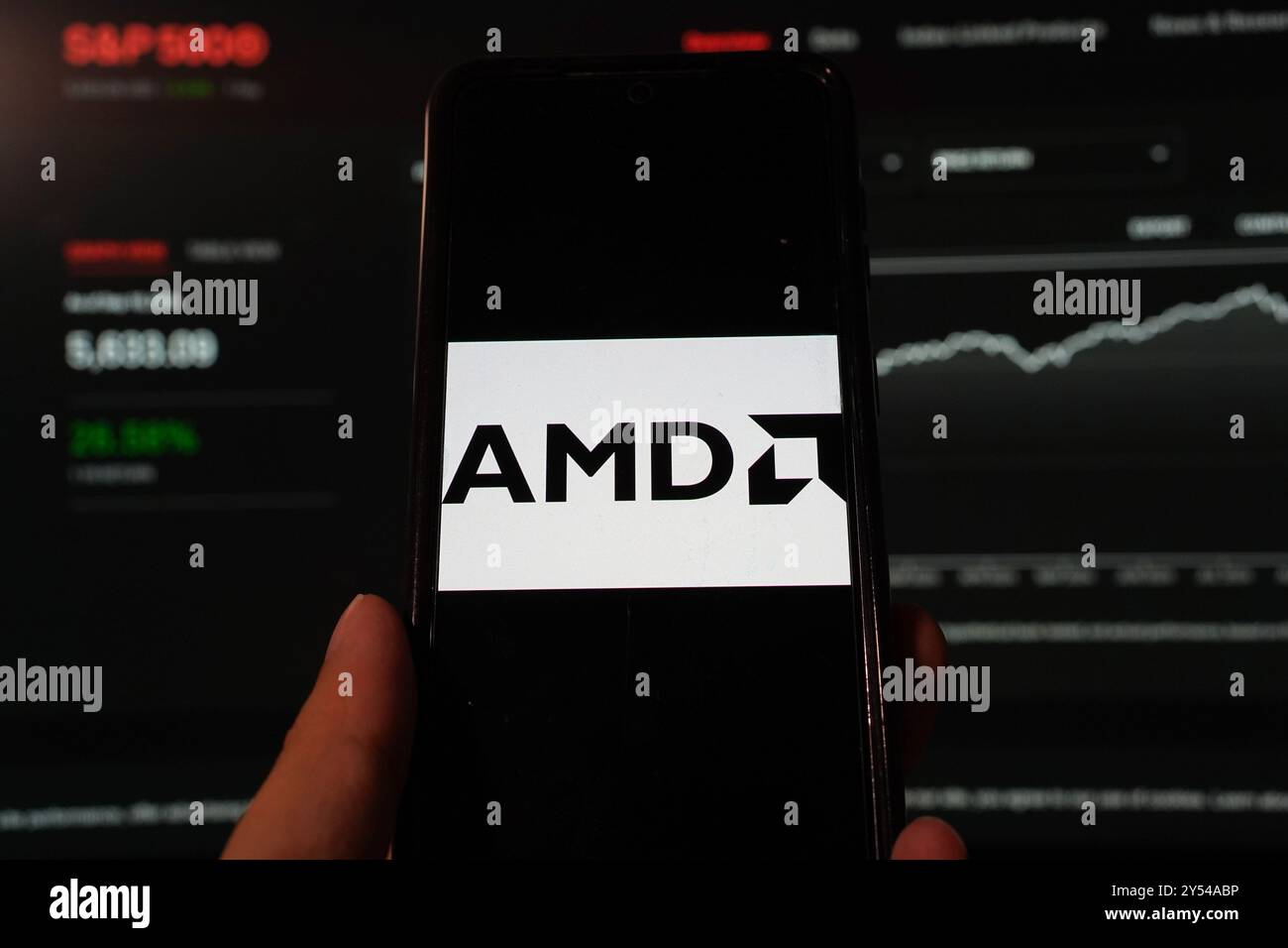 In this photo illustration, Advanced Micro Devices logo (AMD) is displayed on a smartphone with ...