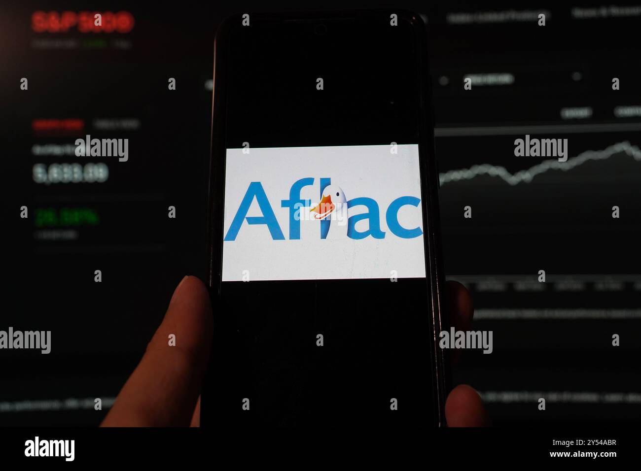 In this photo illustration, Aflac logo is displayed on a smartphone ...