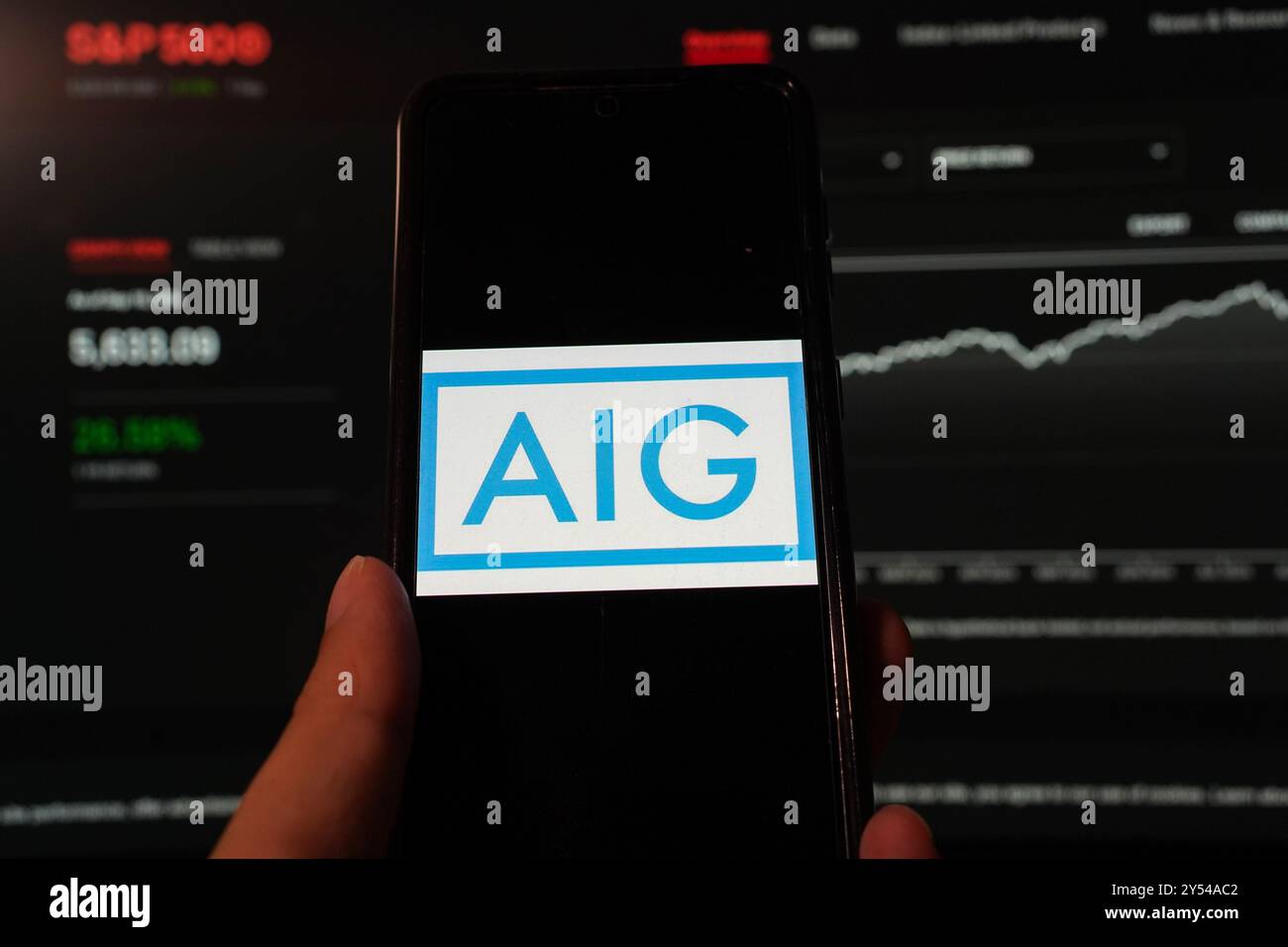 In this photo illustration, American International Group (AIG) logo is displayed on a smartphone ...
