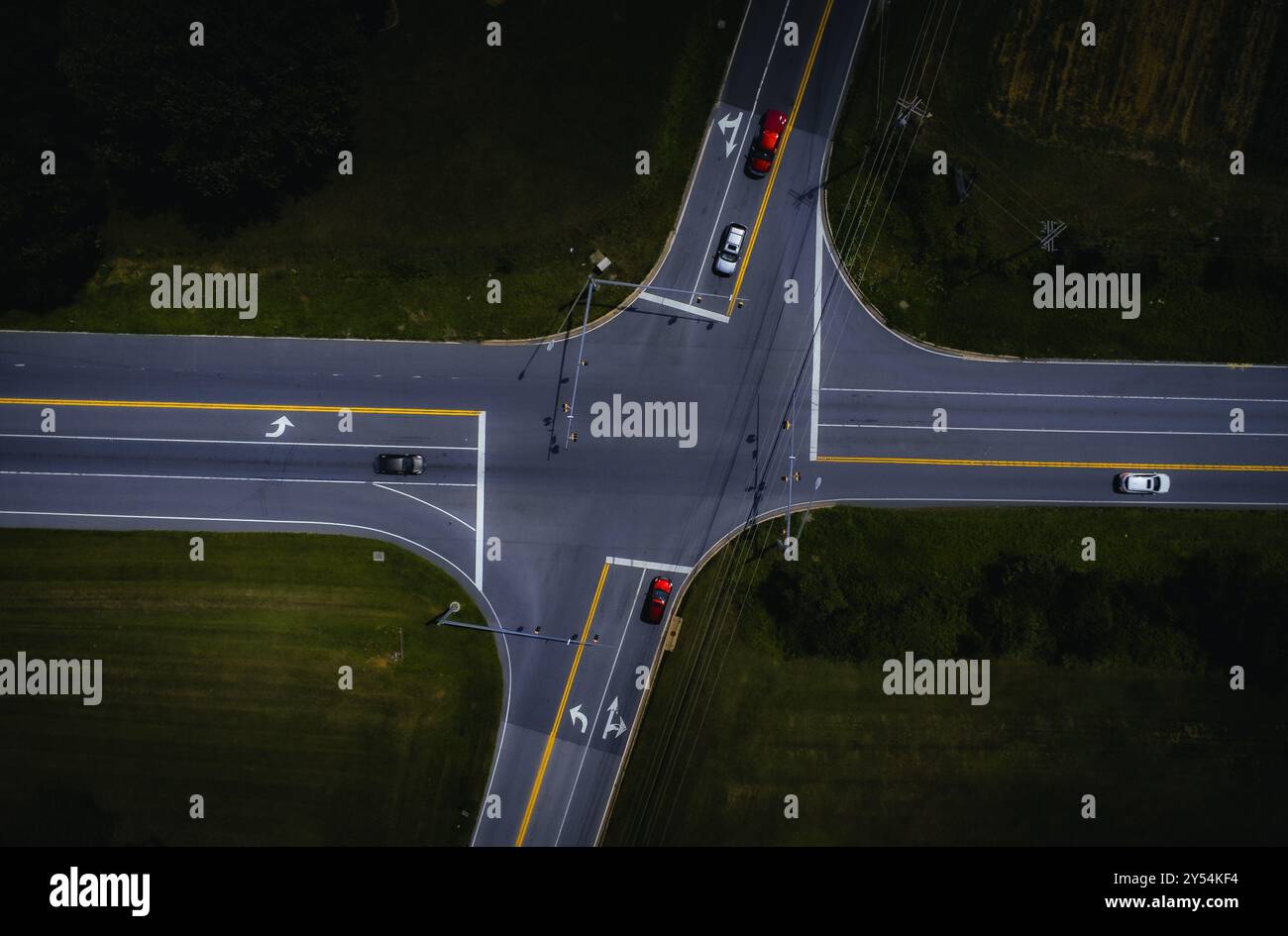 drone photograph of rural intersection with street lights and cars ...