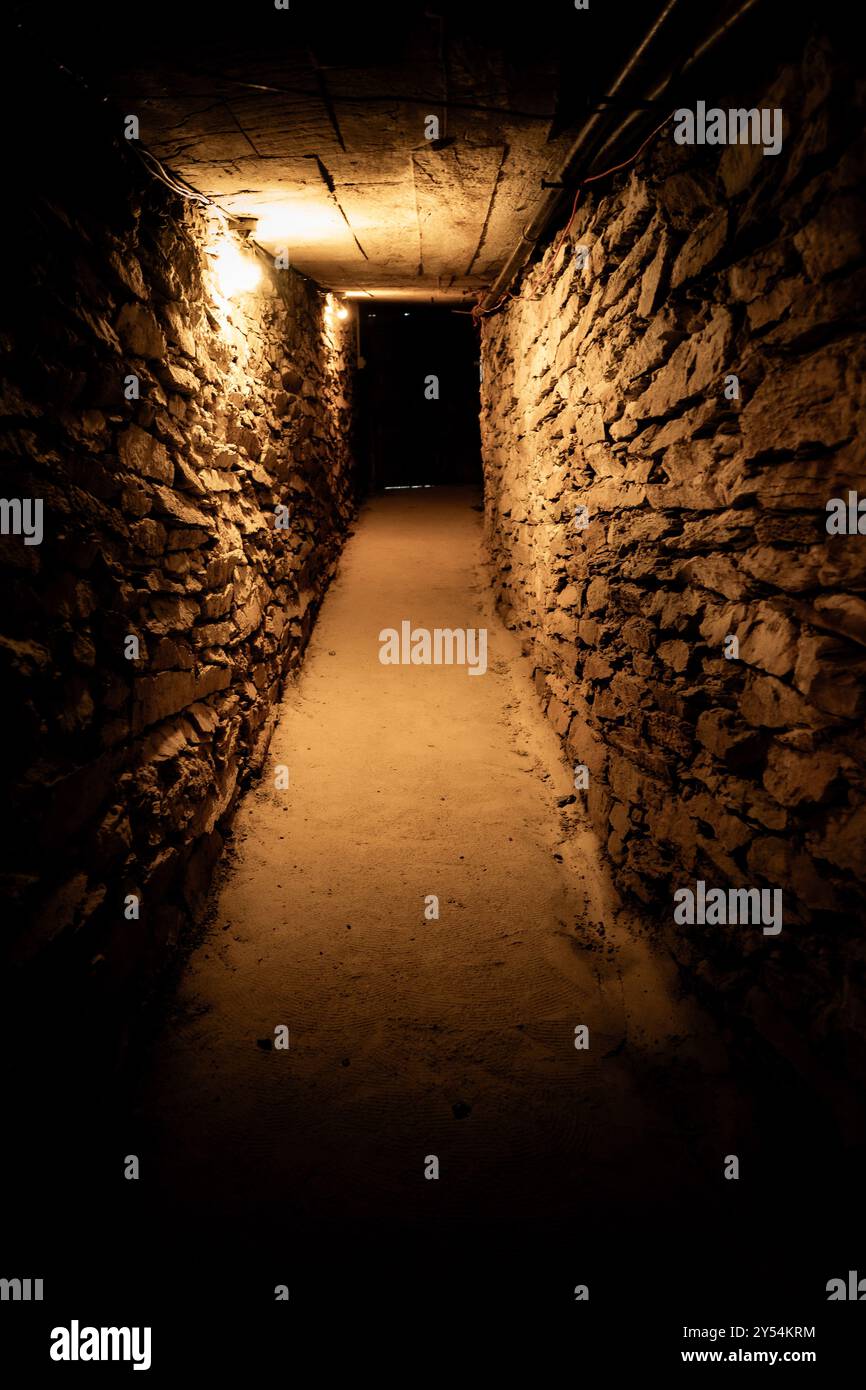 underground stone tunnel to exit cavern Stock Photo - Alamy