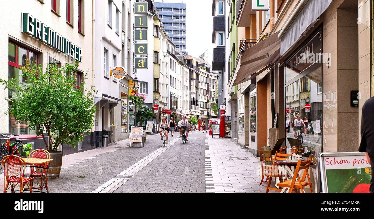 Cyclists on a typical German shopping district streen in Koblenz ...