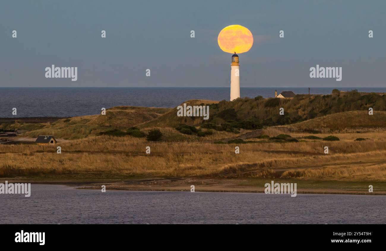 Harvest supermoon rising behind Barns Ness lighthouse, Dunbar, East ...