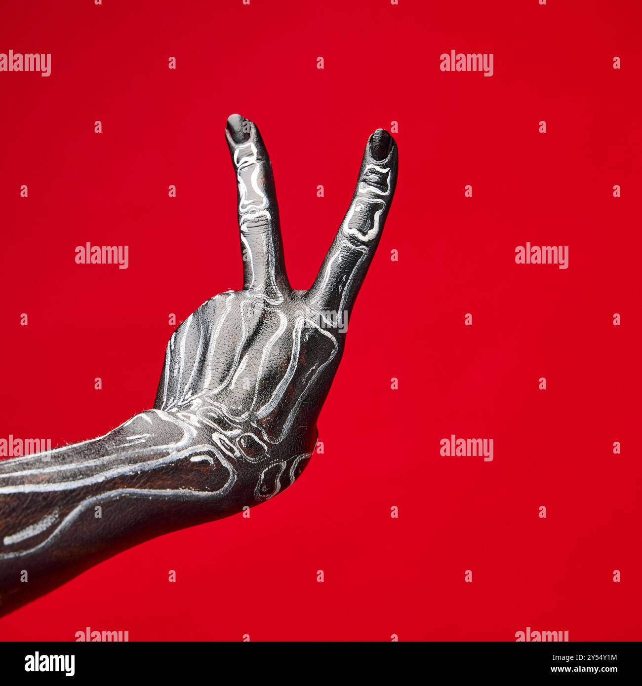 Human hand painted as skeleton against red background. Image suitable ...