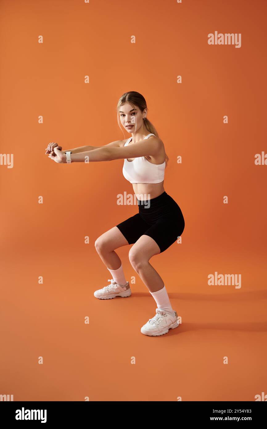 A passionate sportswoman delivers an inspiring pose, highlighting her ...