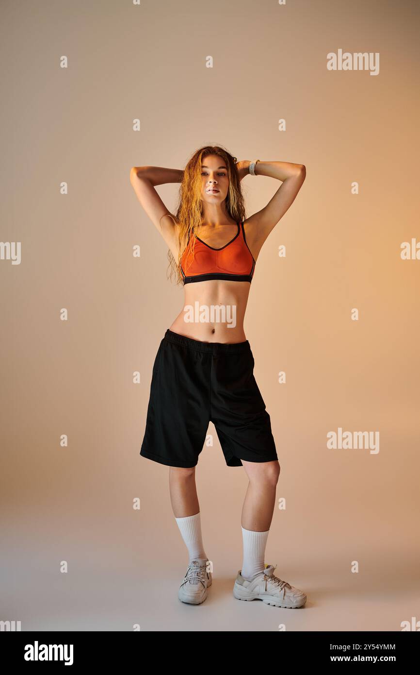 A determined athlete expresses her emotions while showcasing strength ...