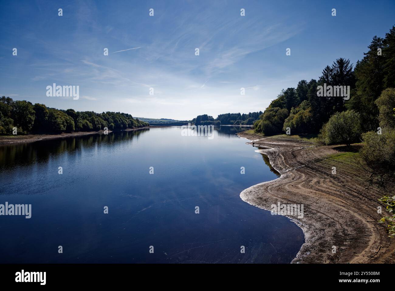 The blue water and sky of late summer at Wayoh Reservoir Stock Photo ...