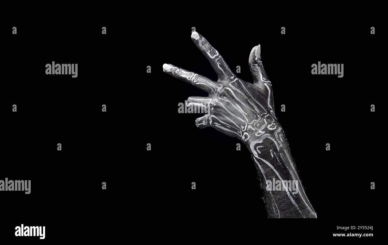 Trick or treat game. Human hand painted as skeleton gesturing against ...