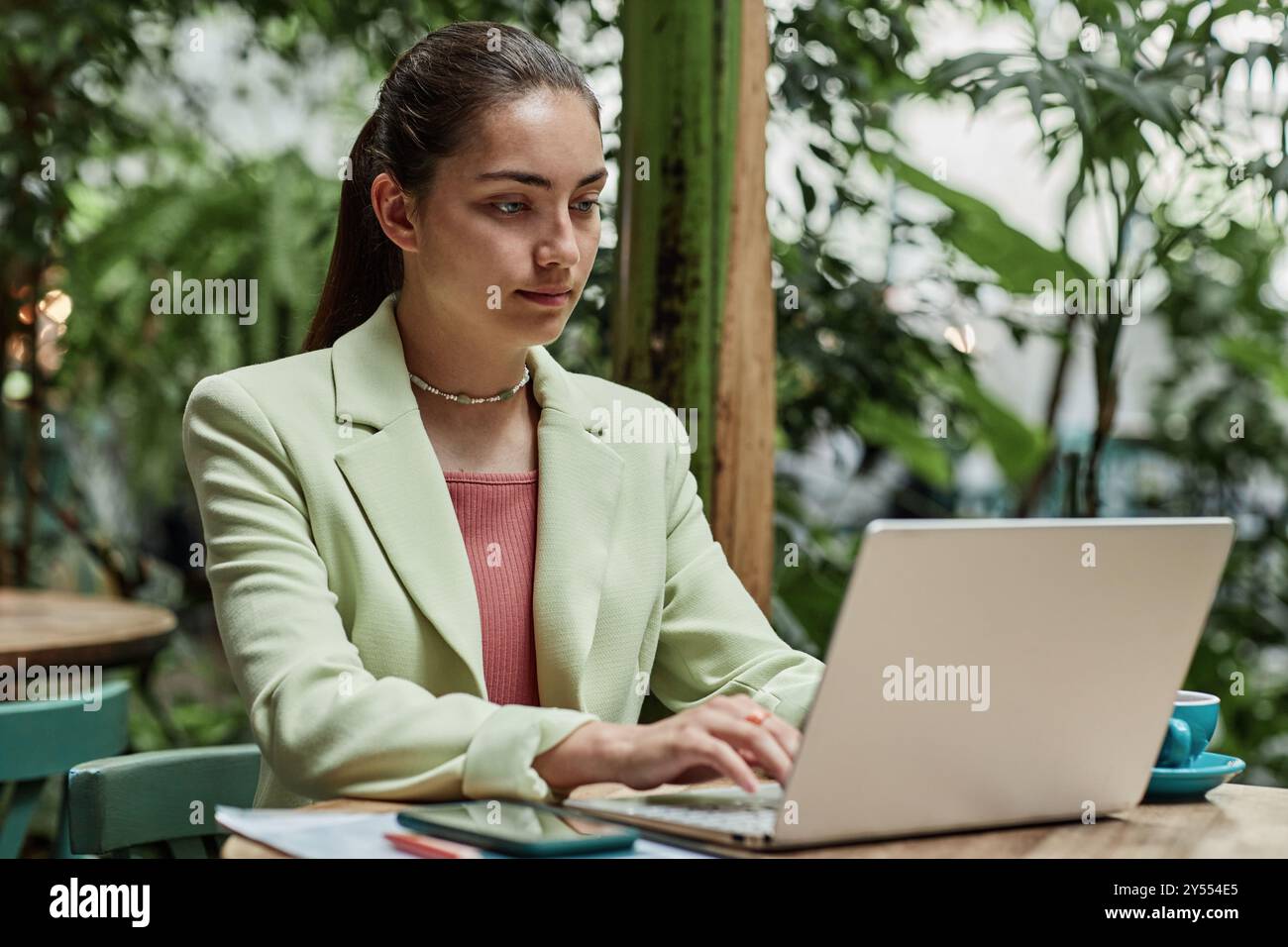 Woman working focused on laptop hi-res stock photography and images - Alamy