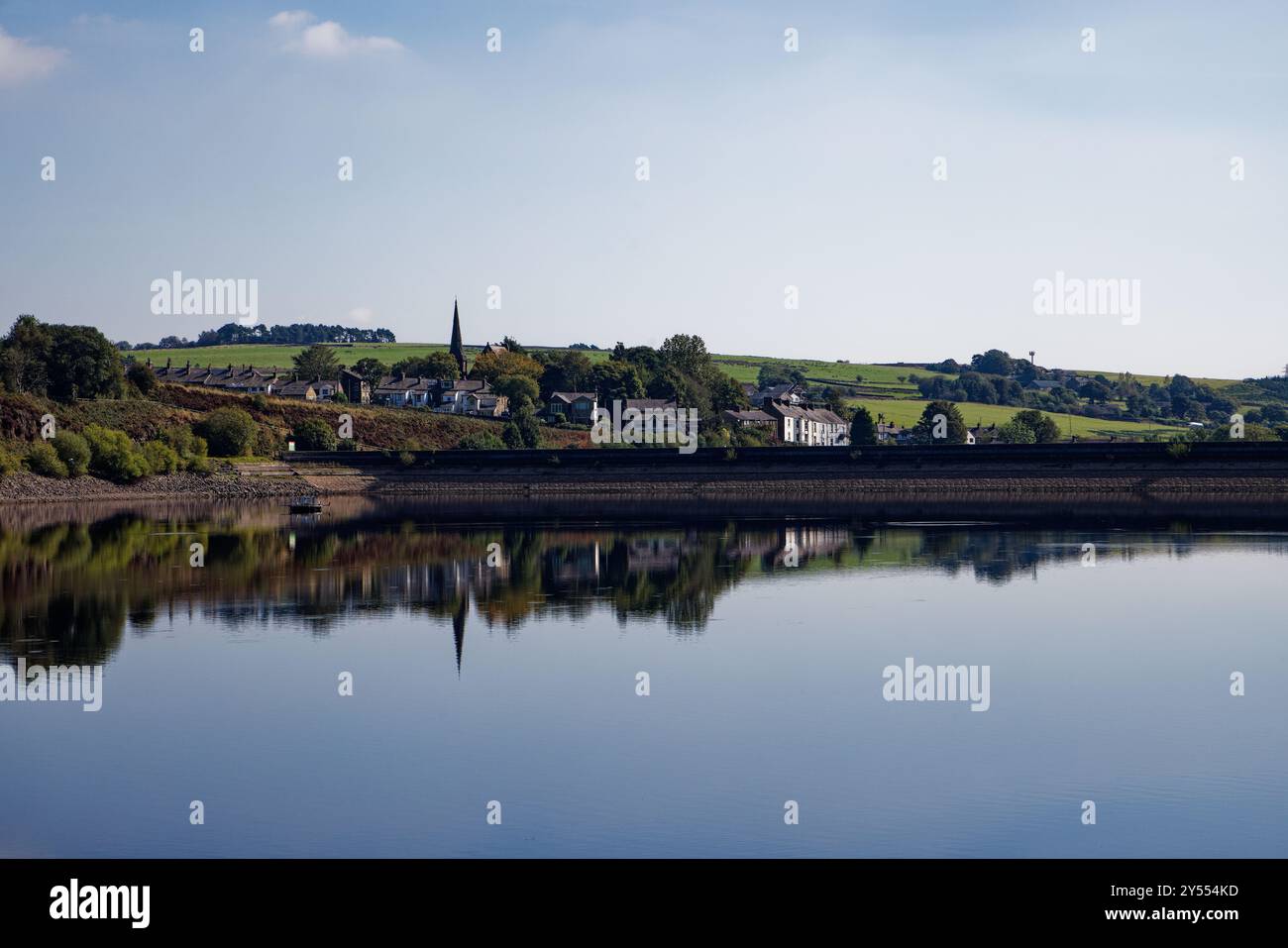 Reflections of the village of Edgworth in the still waters of Wayoh ...