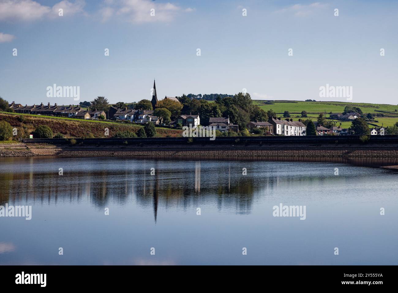 Reflections of the village of Edgworth in the still waters of Wayoh ...
