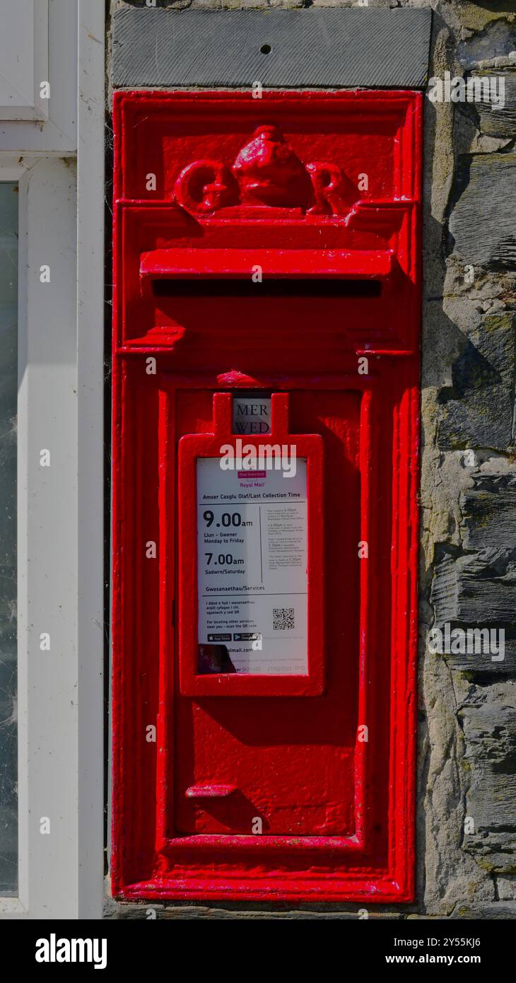 Red GR Post Box with English and Welsh lettering set into a slate ...