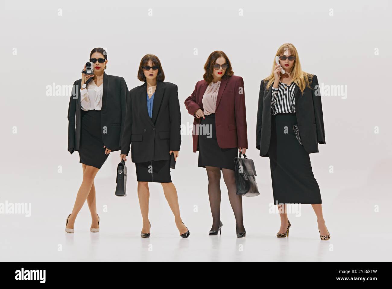 Stylish women, each in powerful stance with business attire, sunglasses ...