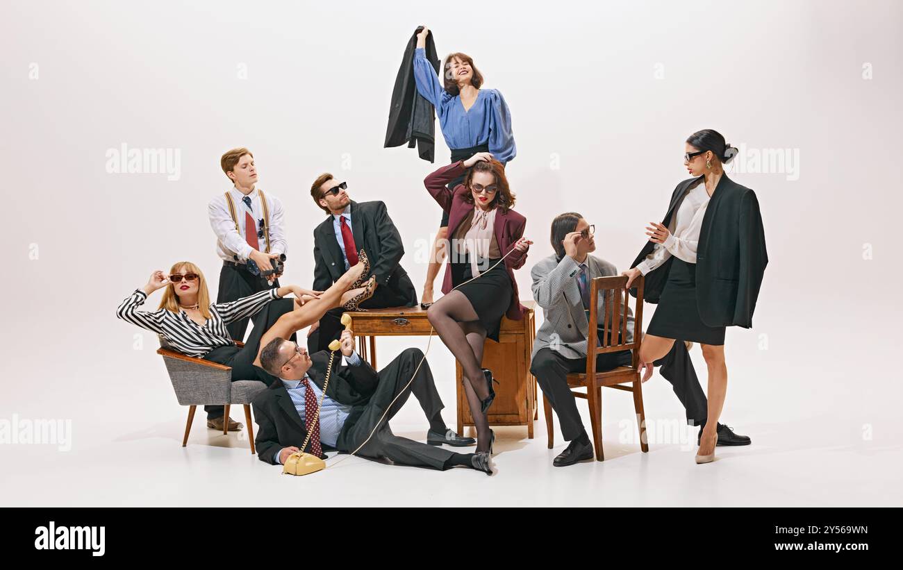 Quirky office scene unfolds as eight employees, dressed in business ...