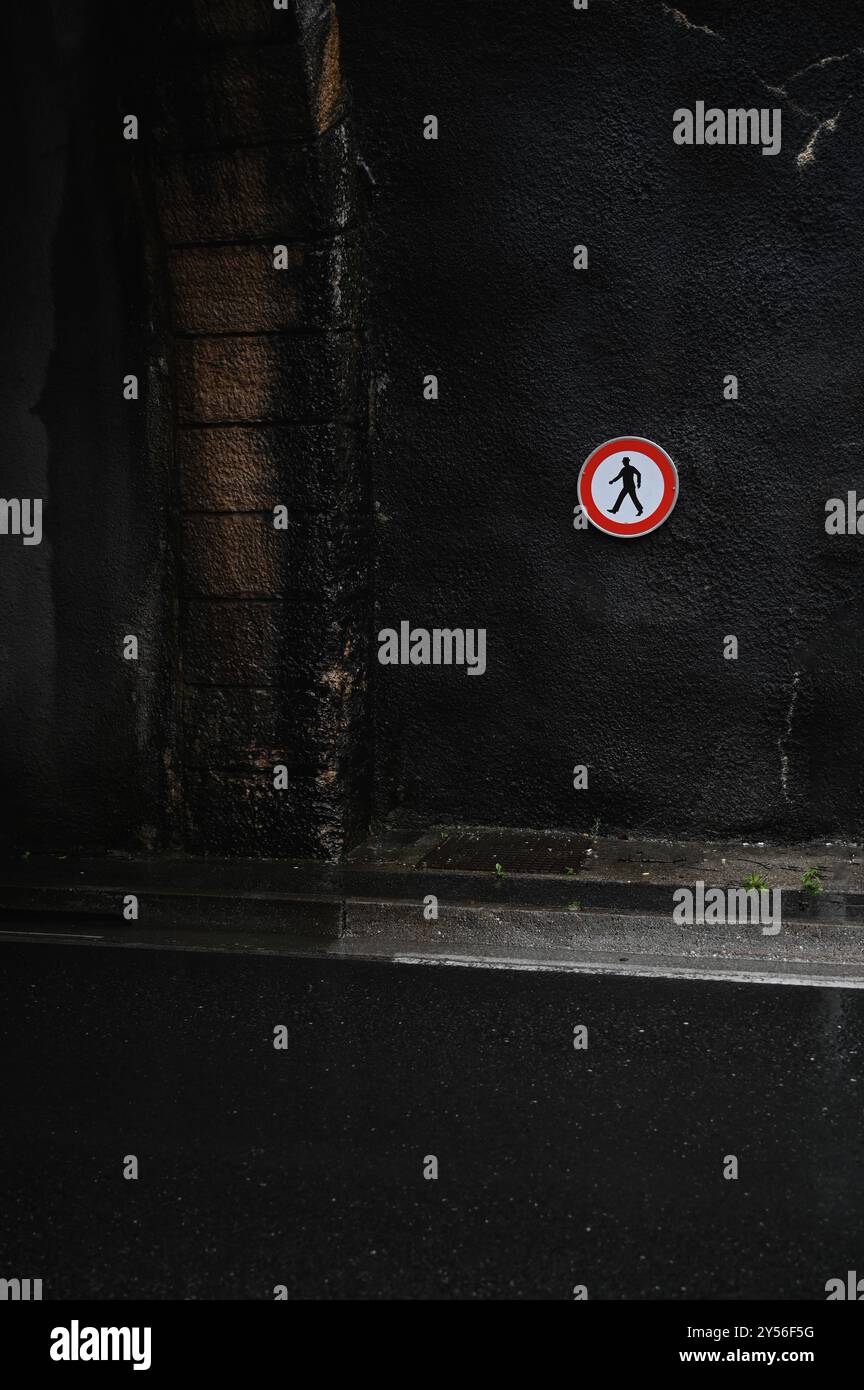 A Do not enter sign at the entrance to a tunnel. People Walk Forbidden ...