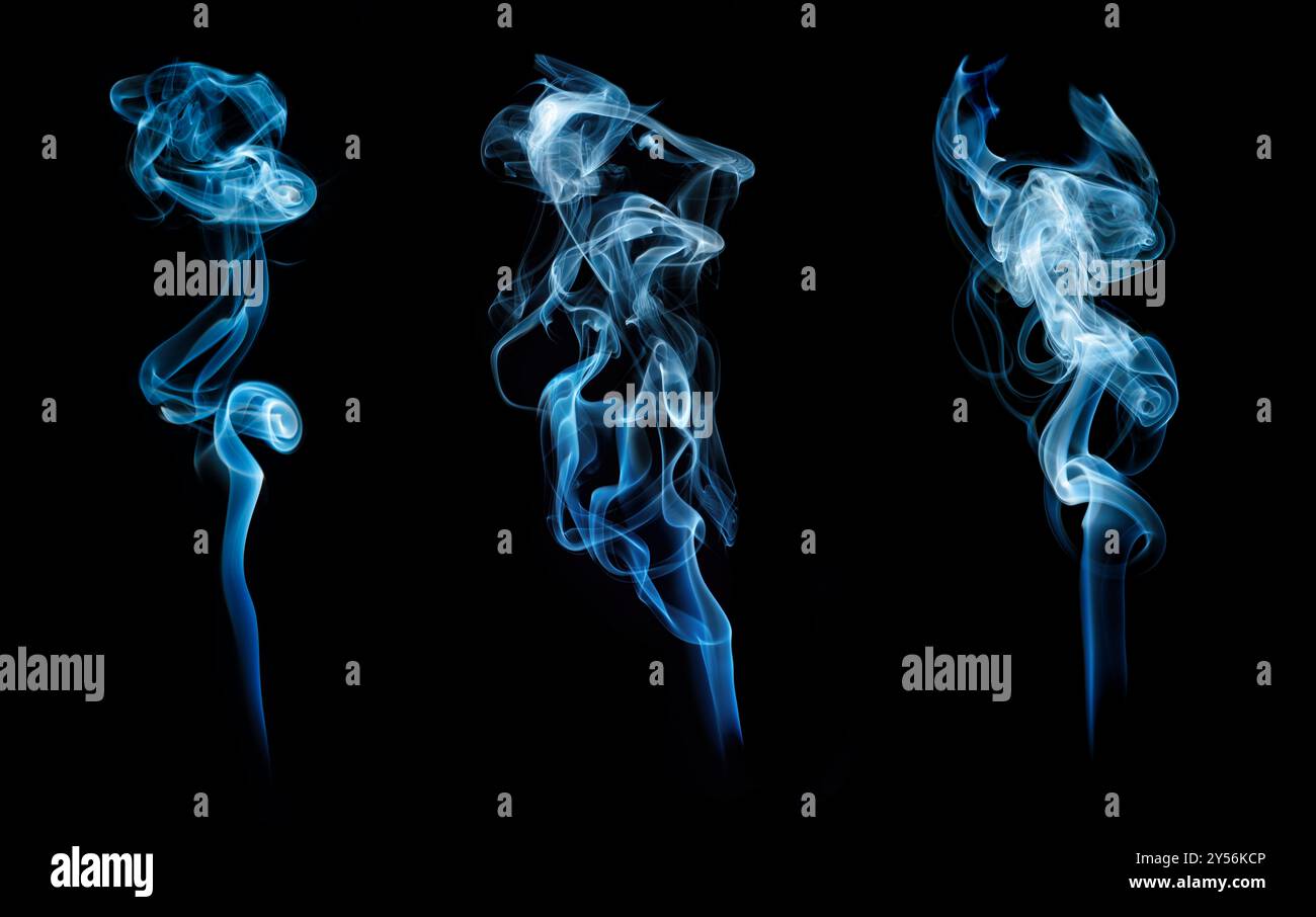 Three distinct blue smoke shapes rising up against a black background ... Three distinct blue smoke shapes rising up against a black background ...