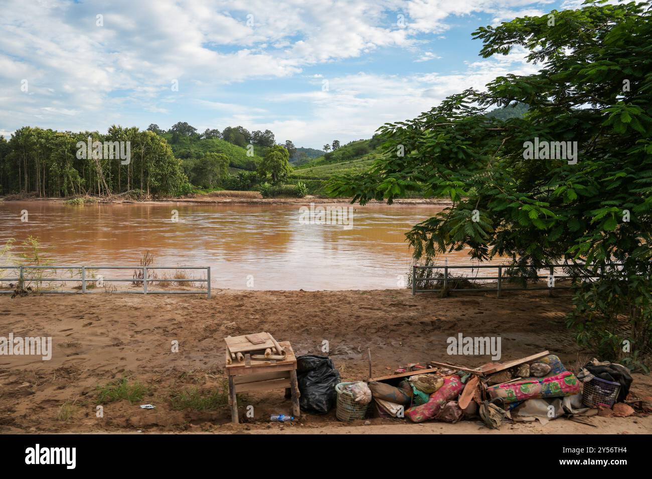 A view of the Kok River with the high level of water and mud on its ...