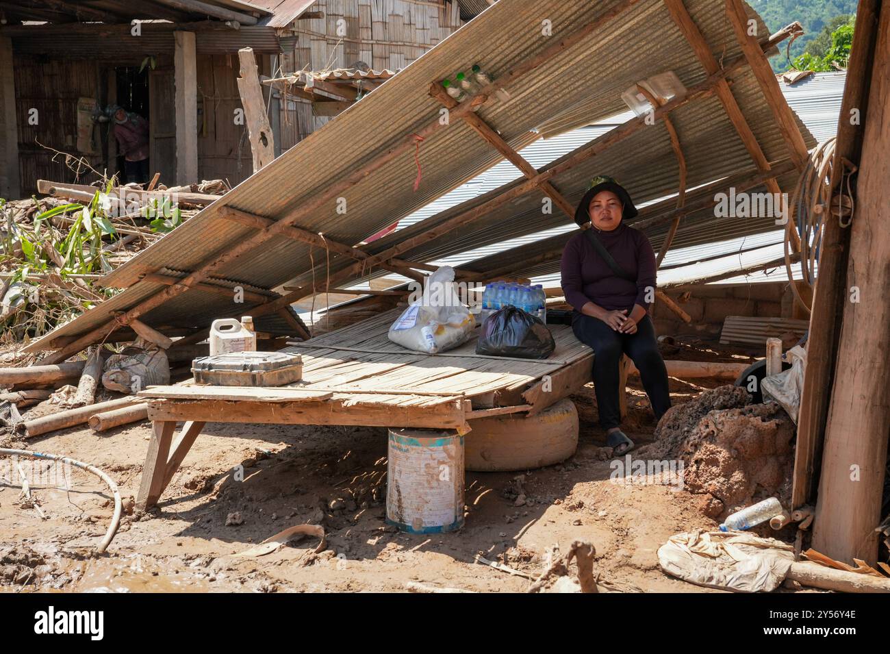 September 17, 2024, Chiang Rai, Thailand: A woman is seen sitting under ...