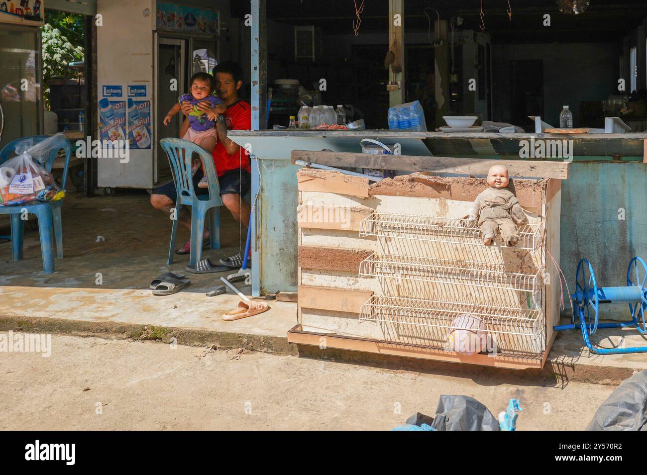 Chiang Rai, Thailand. 17th Sep, 2024. A man and his kid are sitting in ...