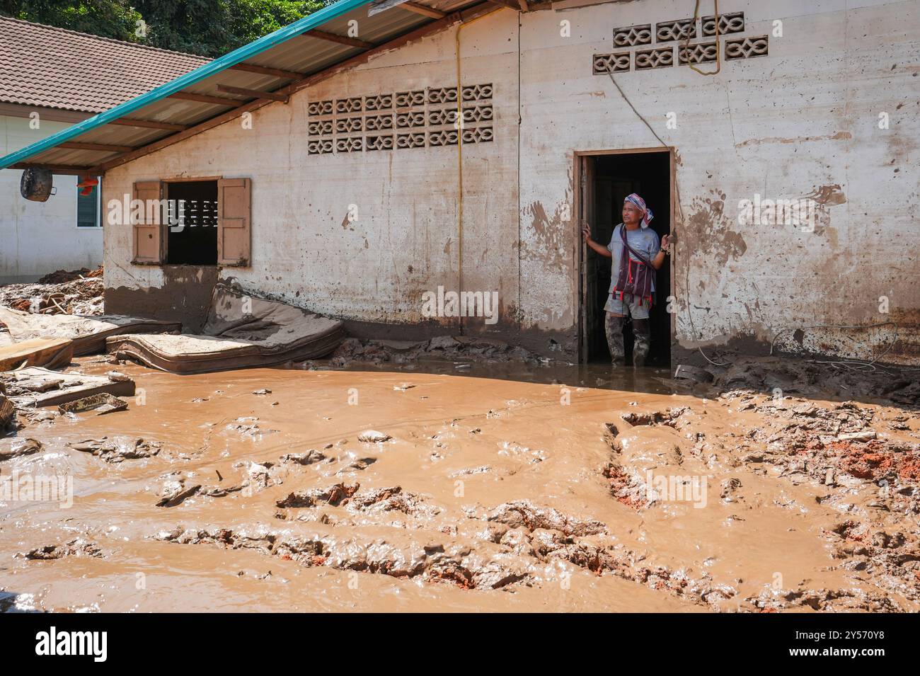 Chiang Rai, Thailand. 17th Sep, 2024. A man is standing at the entrance ...