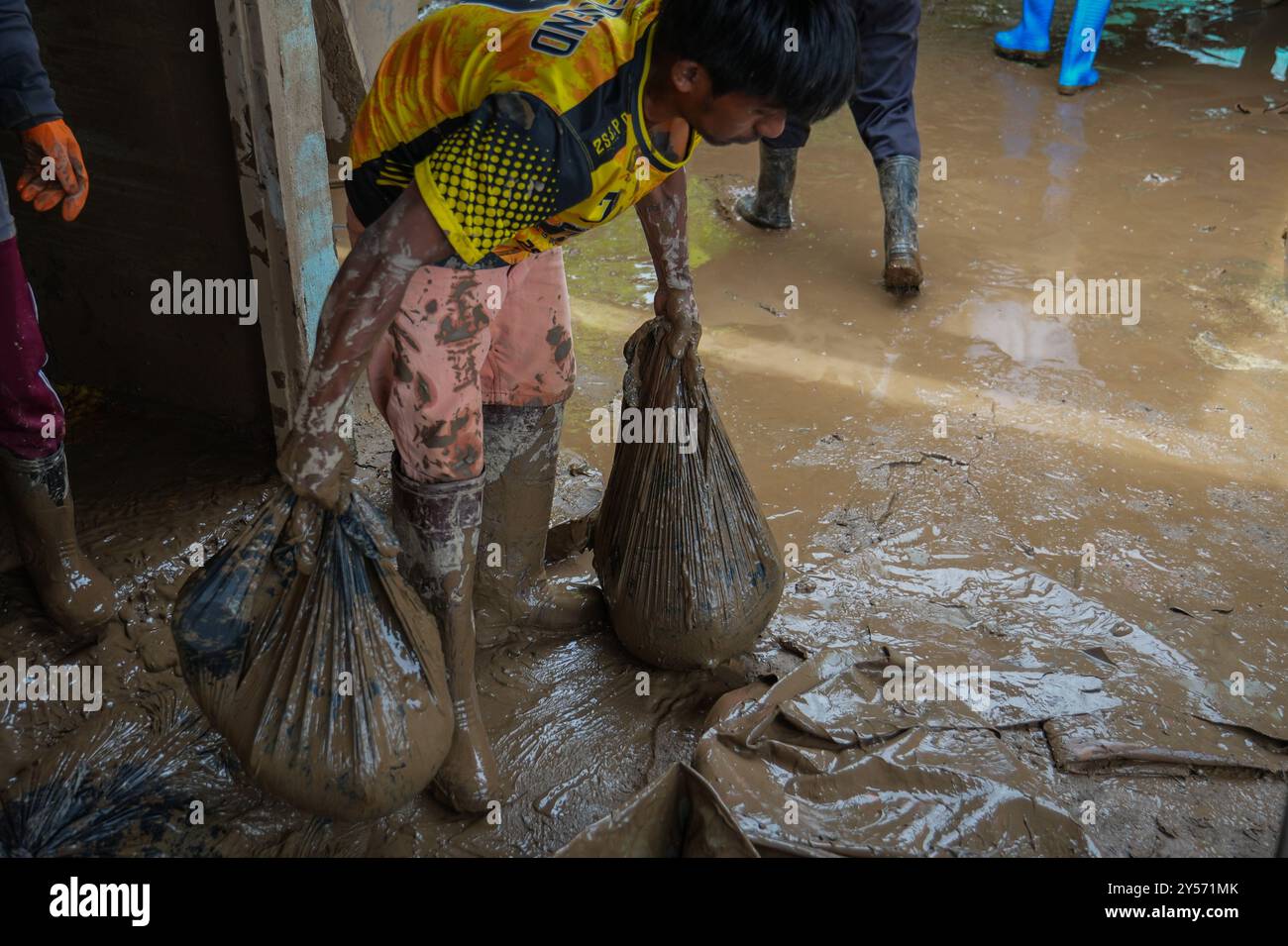 September 18, 2024, Chiang Rai, Thailand: A man is seen holding garbage ...