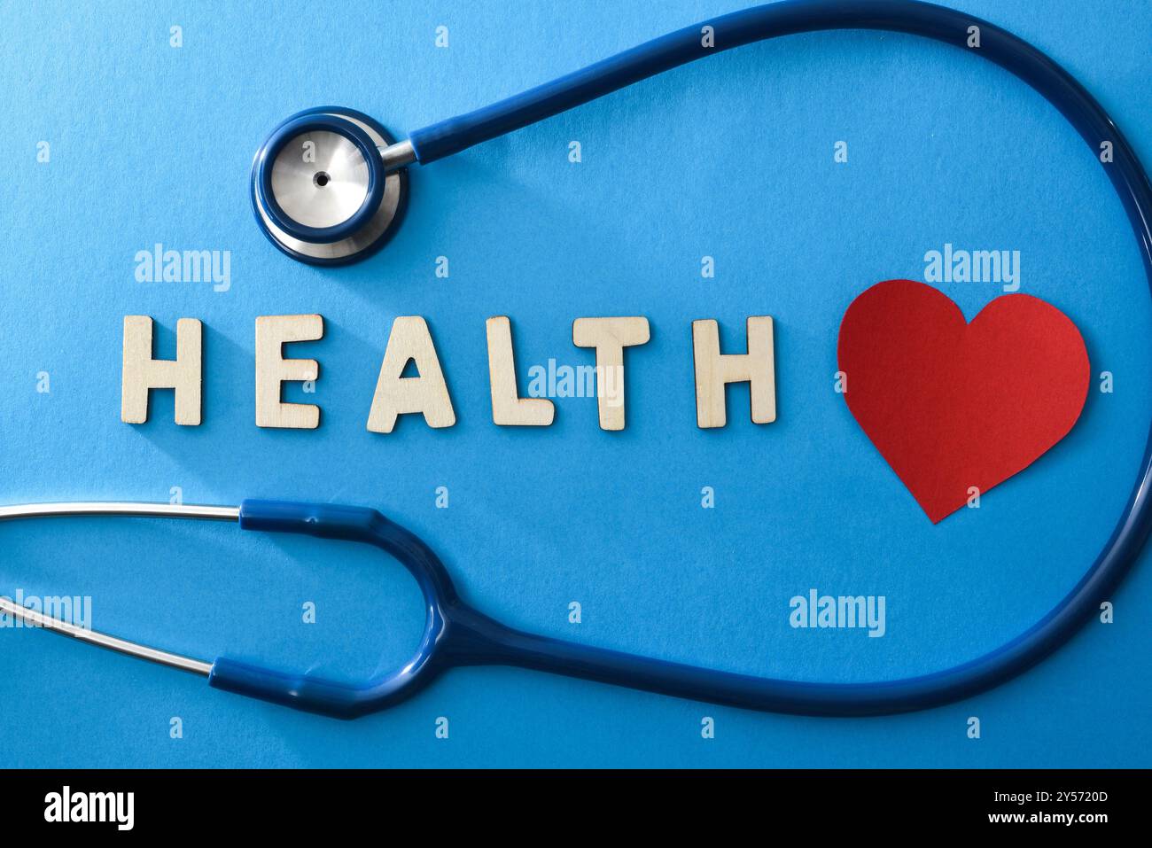 Health background with stethoscope and health message with wooden ...