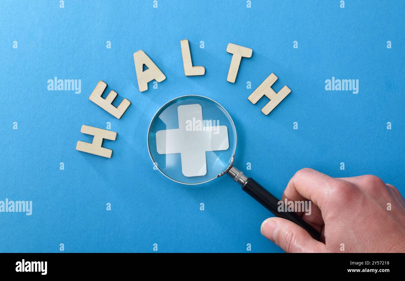 Medical information and examination background with hand magnifying a ...