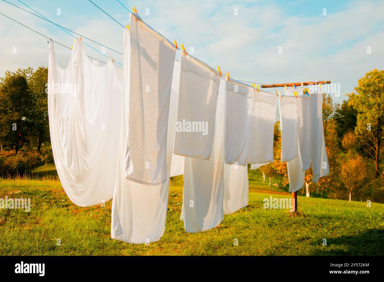 Fresh clean white sheet drying on washing line in outdoor Stock Photo ...