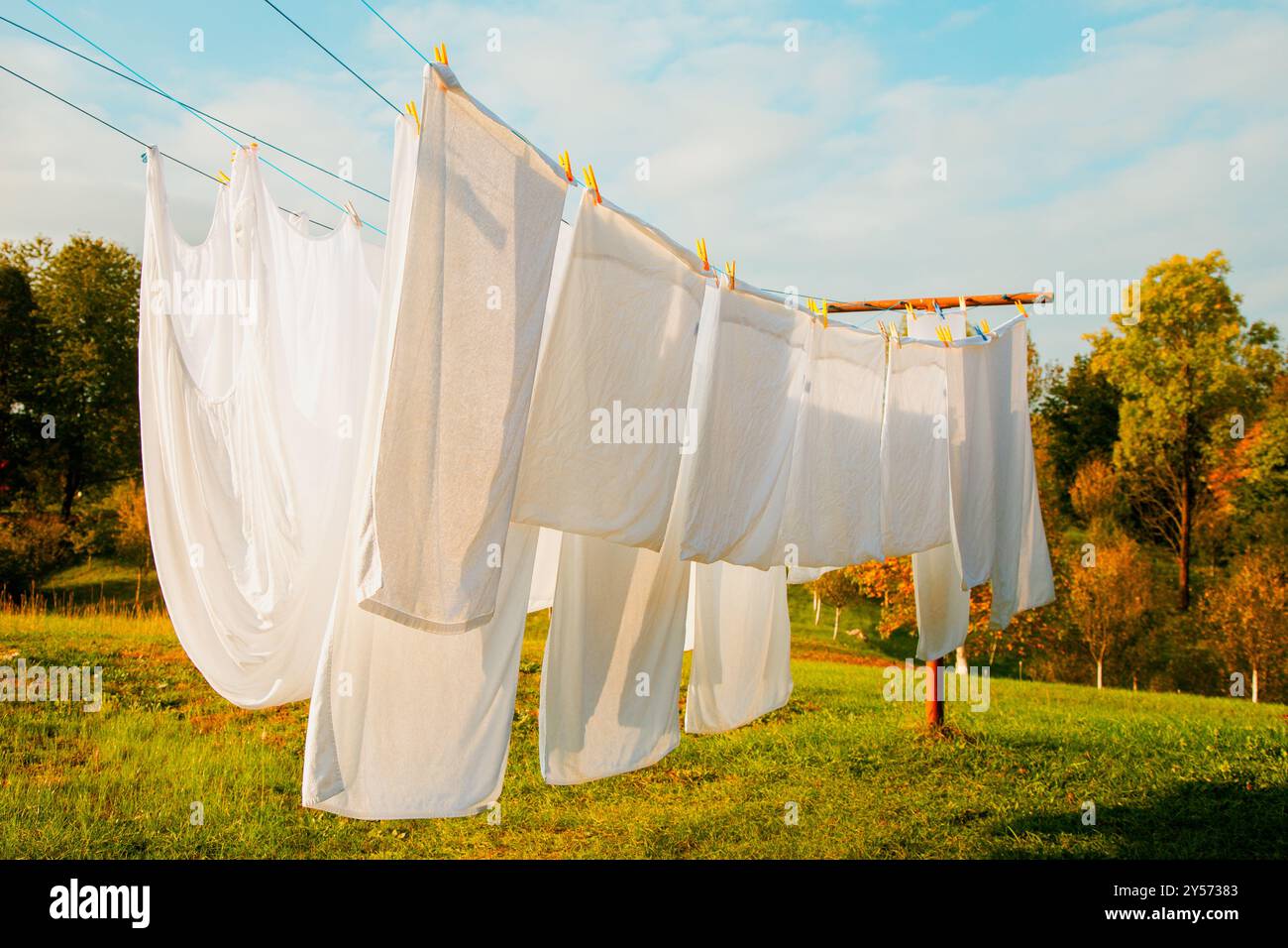 Fresh clean white sheet drying on washing line in outdoor Stock Photo ...