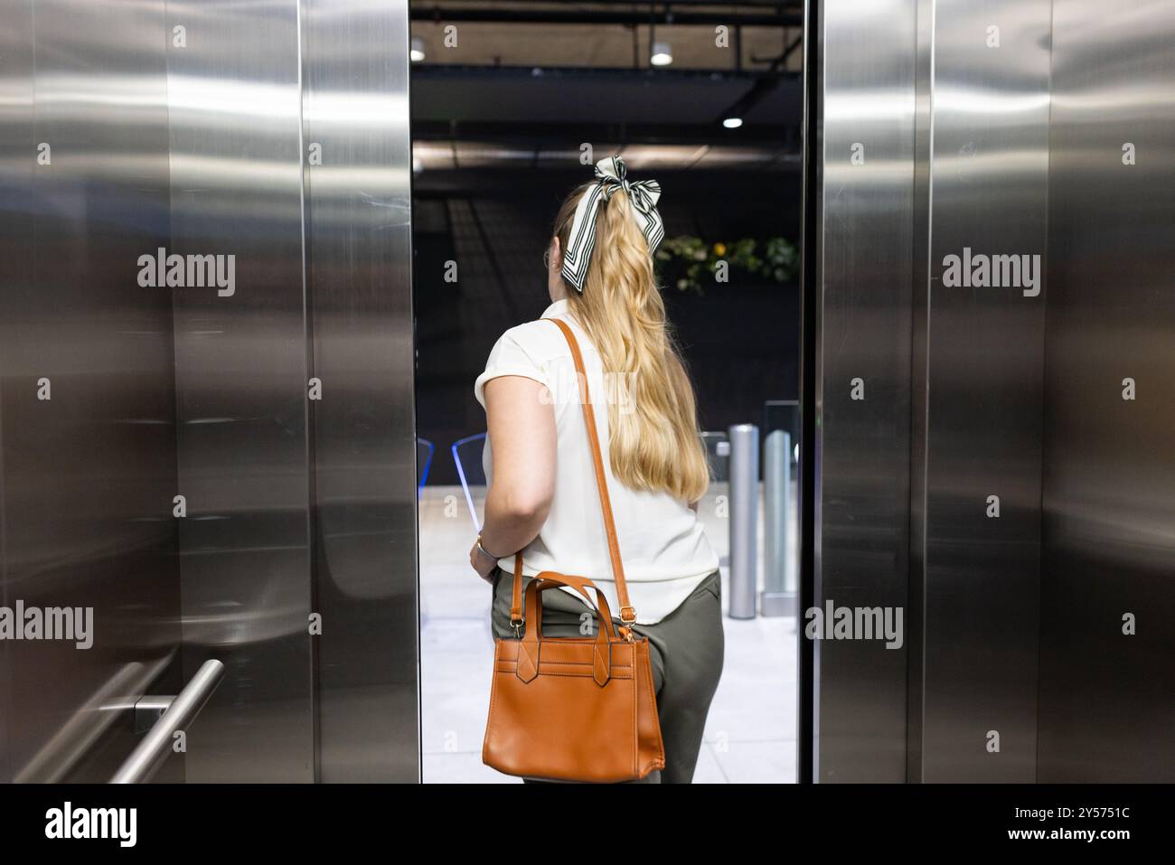 Woman walking office reception lobby hi-res stock photography and ...