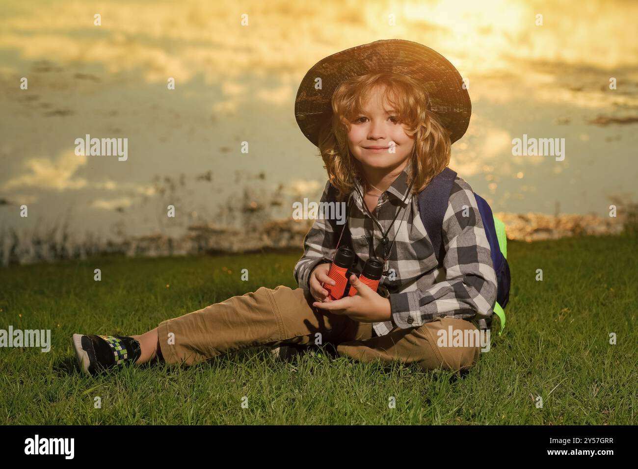 Travel and adventure concept. Little child boy tourist explorer with ...