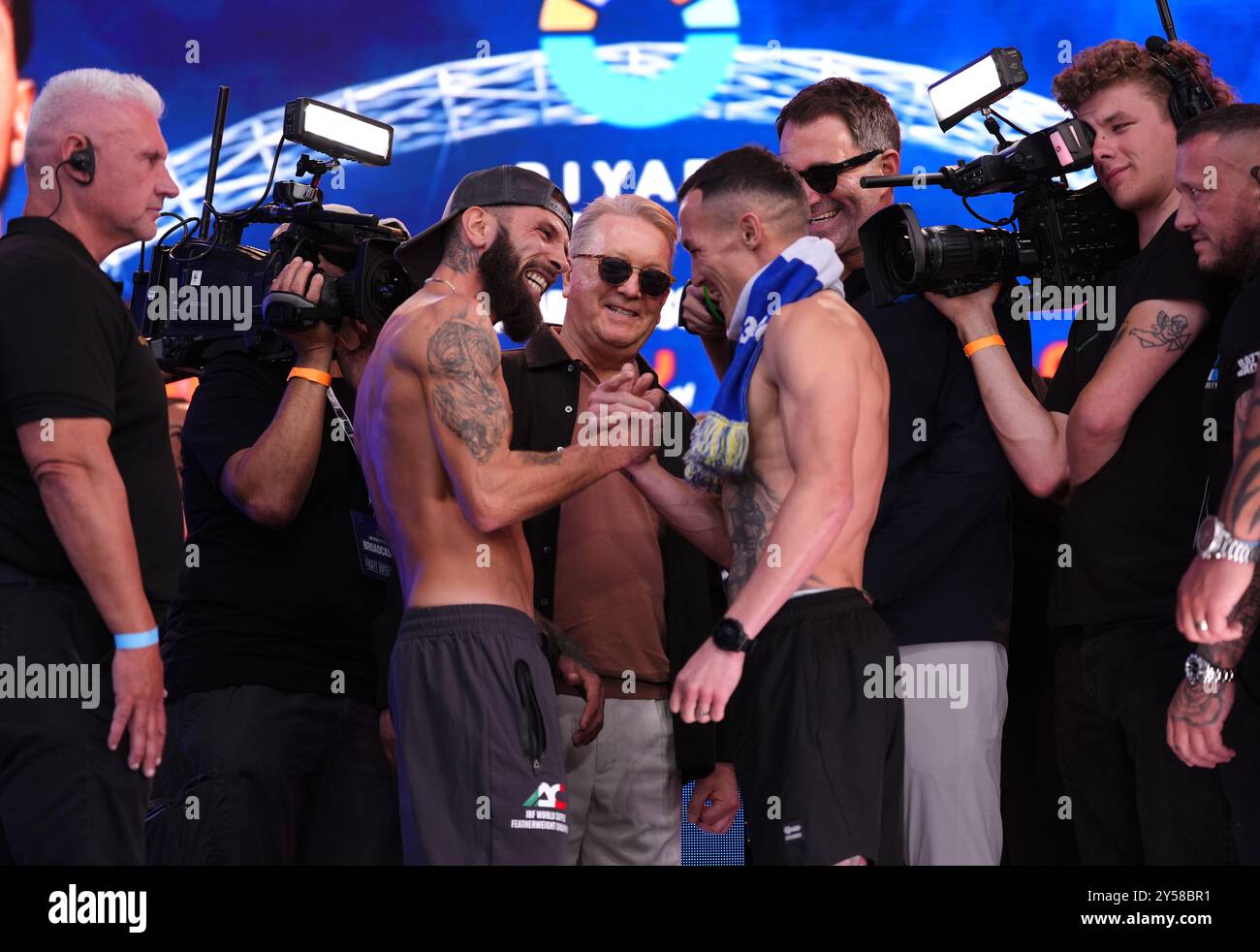 Anthony Cacace and Josh Warrington during a weigh-in at Trafalgar ...