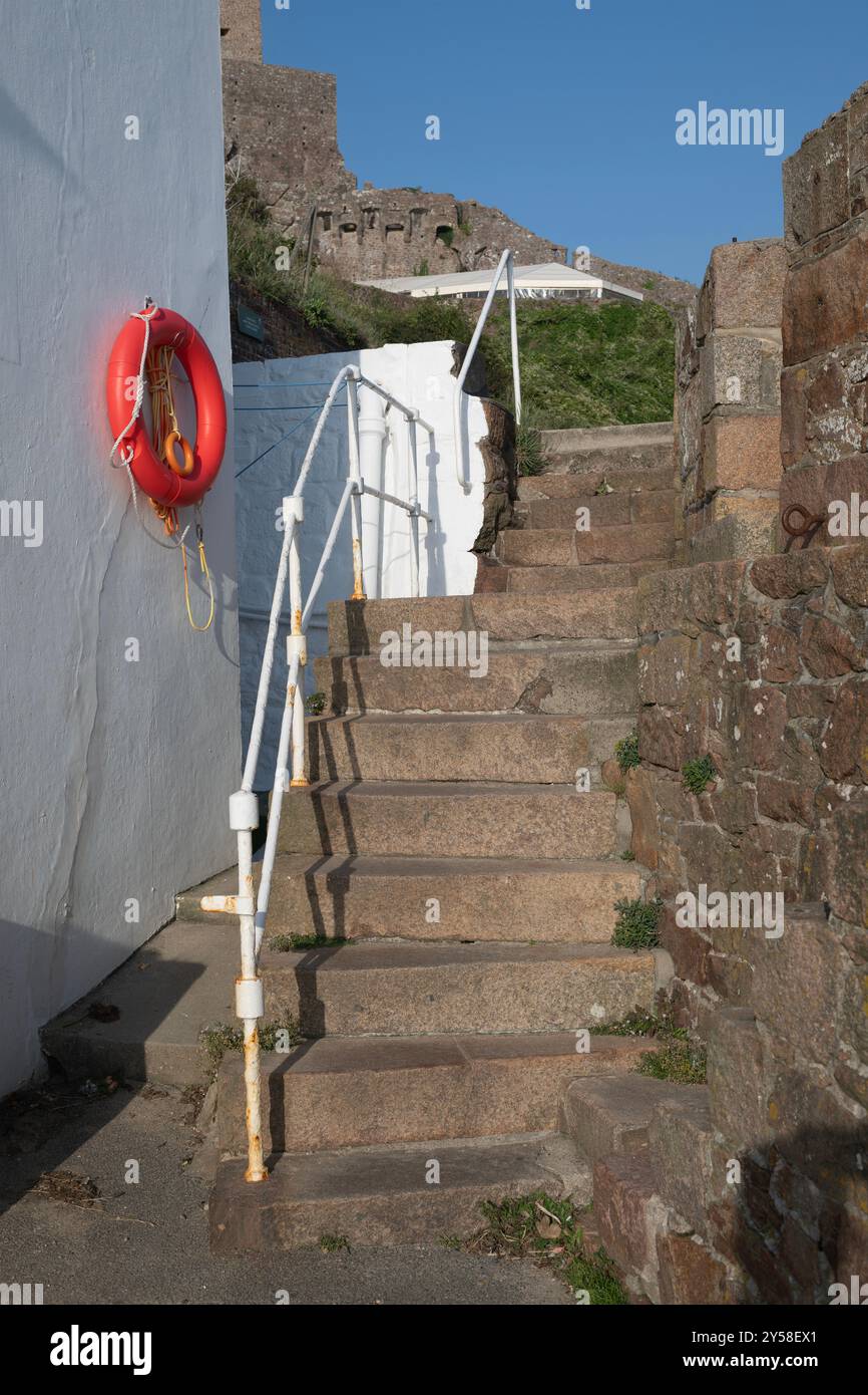 Stairs lead up to a castle at the harbour in Gorey. The stairs are made ...