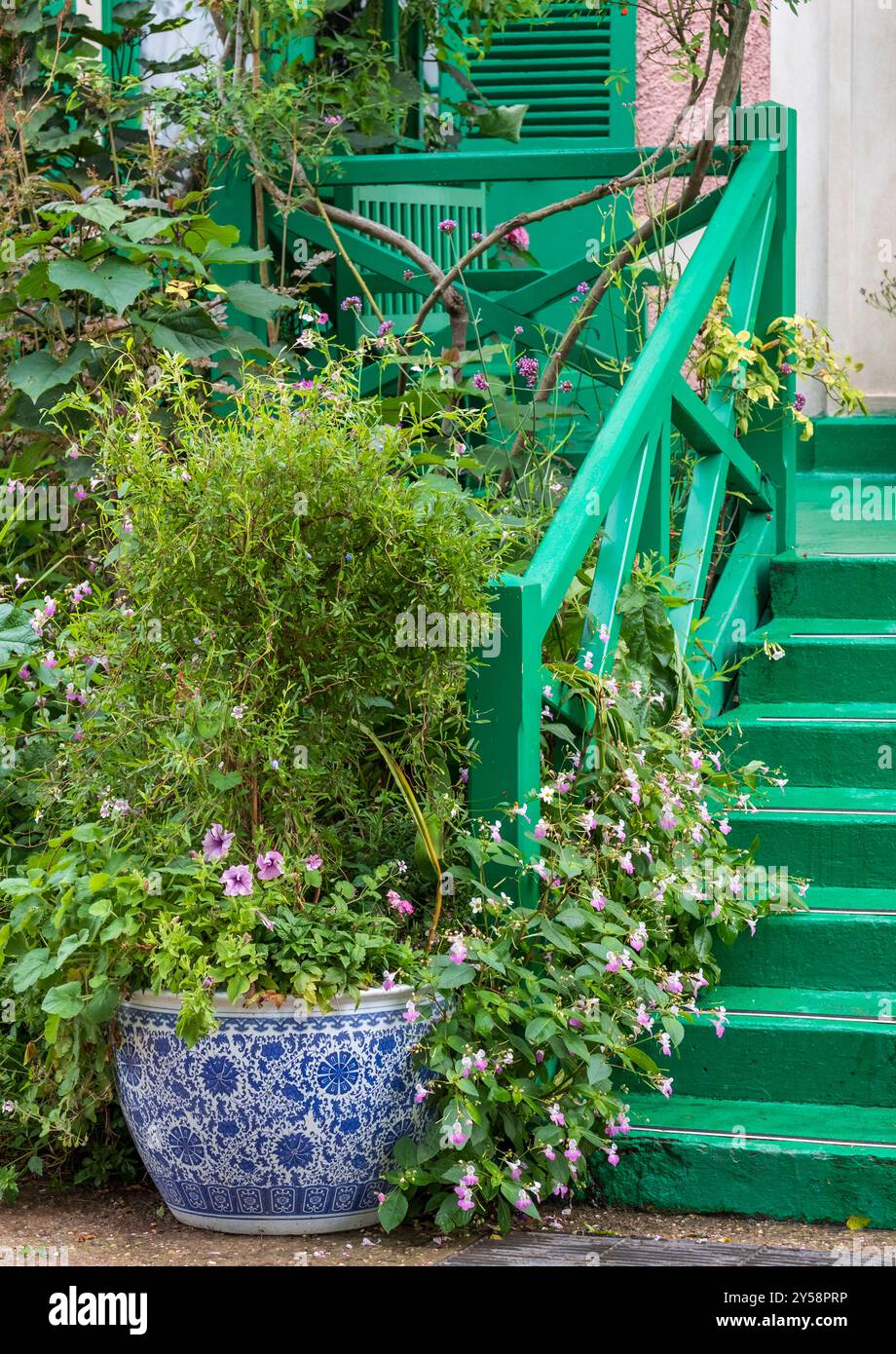 Colourful flowers on the veranda of the house of the impressionist ...