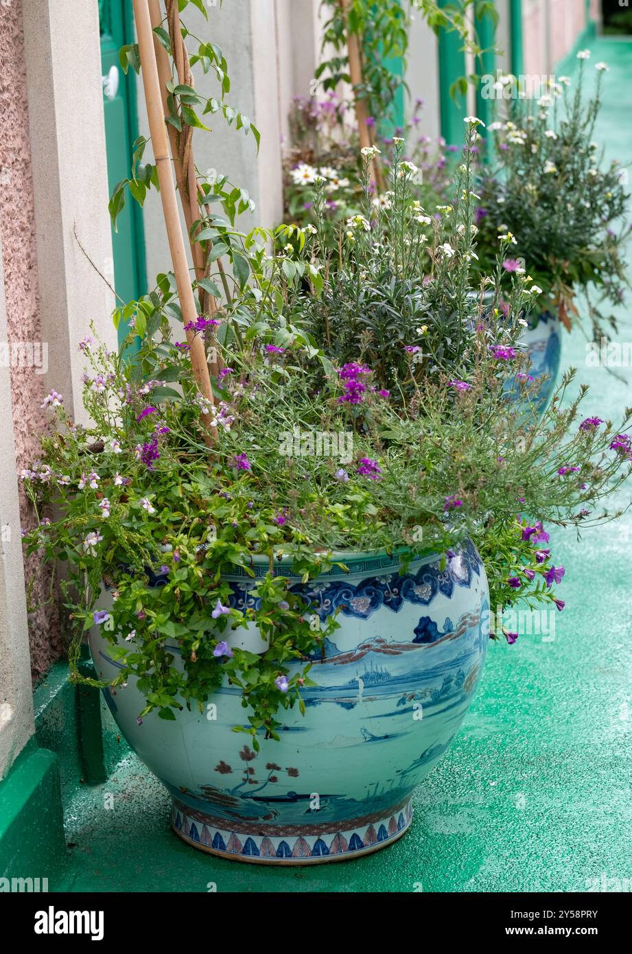 Colourful flowers on the veranda of the house of the impressionist ...