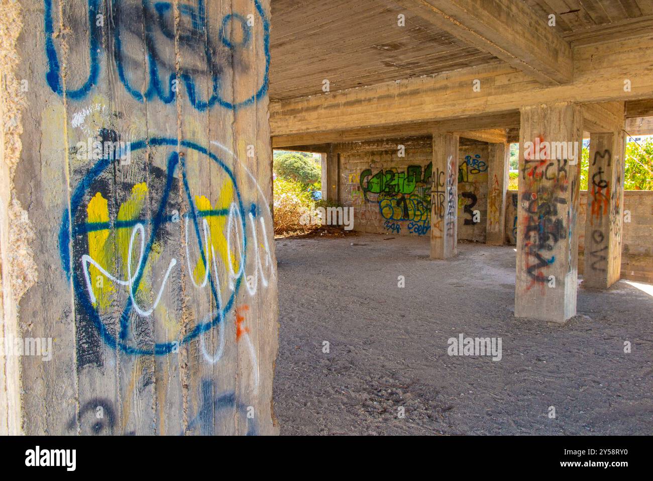 An abandoned industrial building with graffiti tags Stock Photo - Alamy