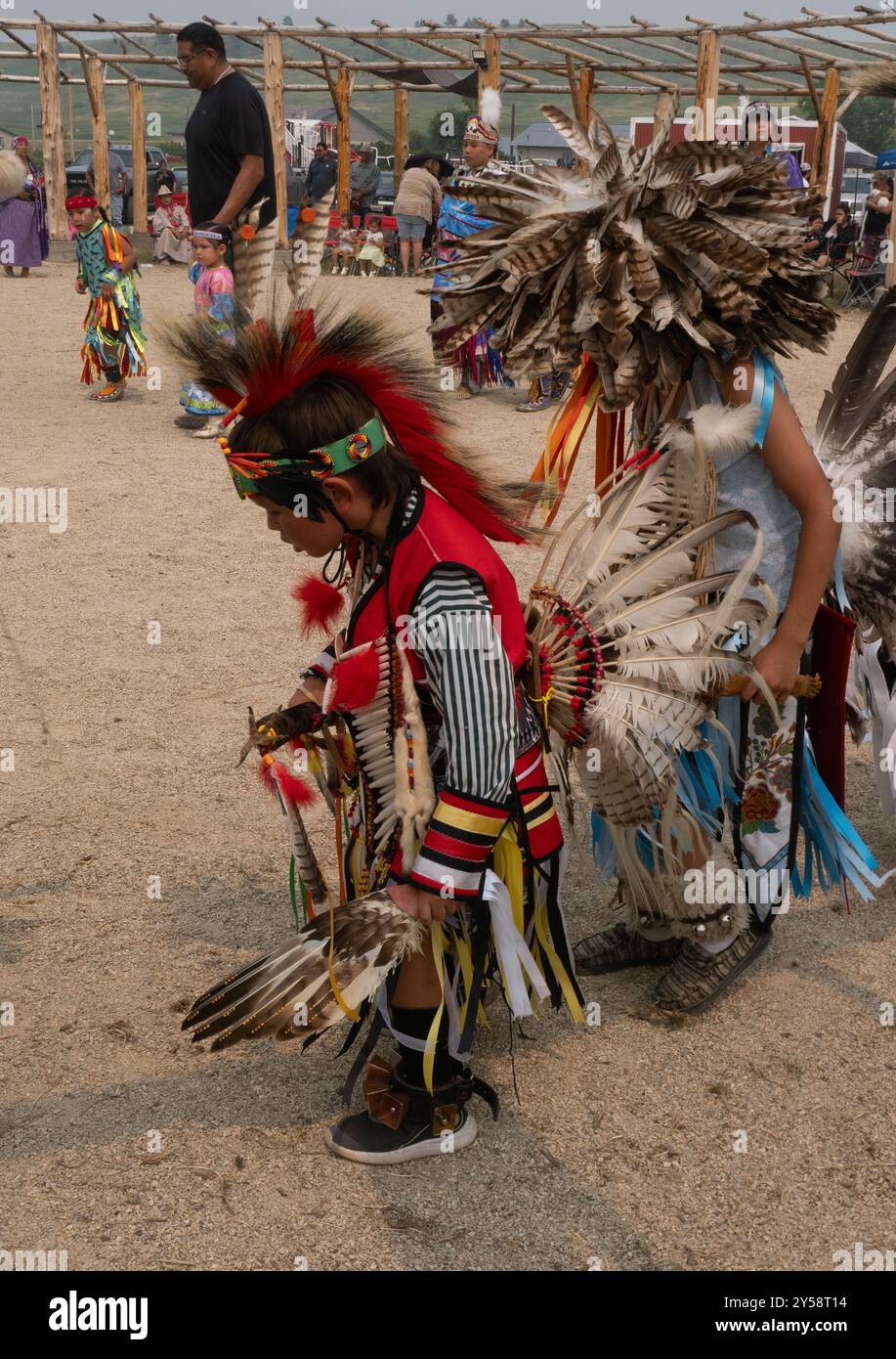 Native American boys dressed in traditional and fancy dancer costumes ...